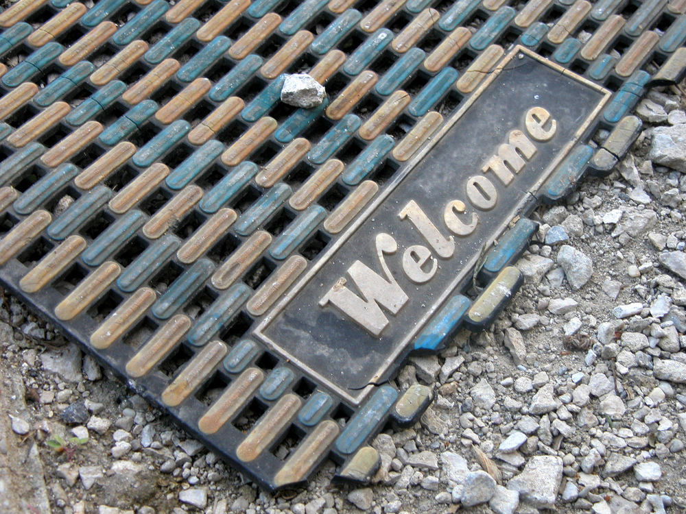 Graffiti Compasses, Welcome Mats, and the Art of the Generous Greeting ...